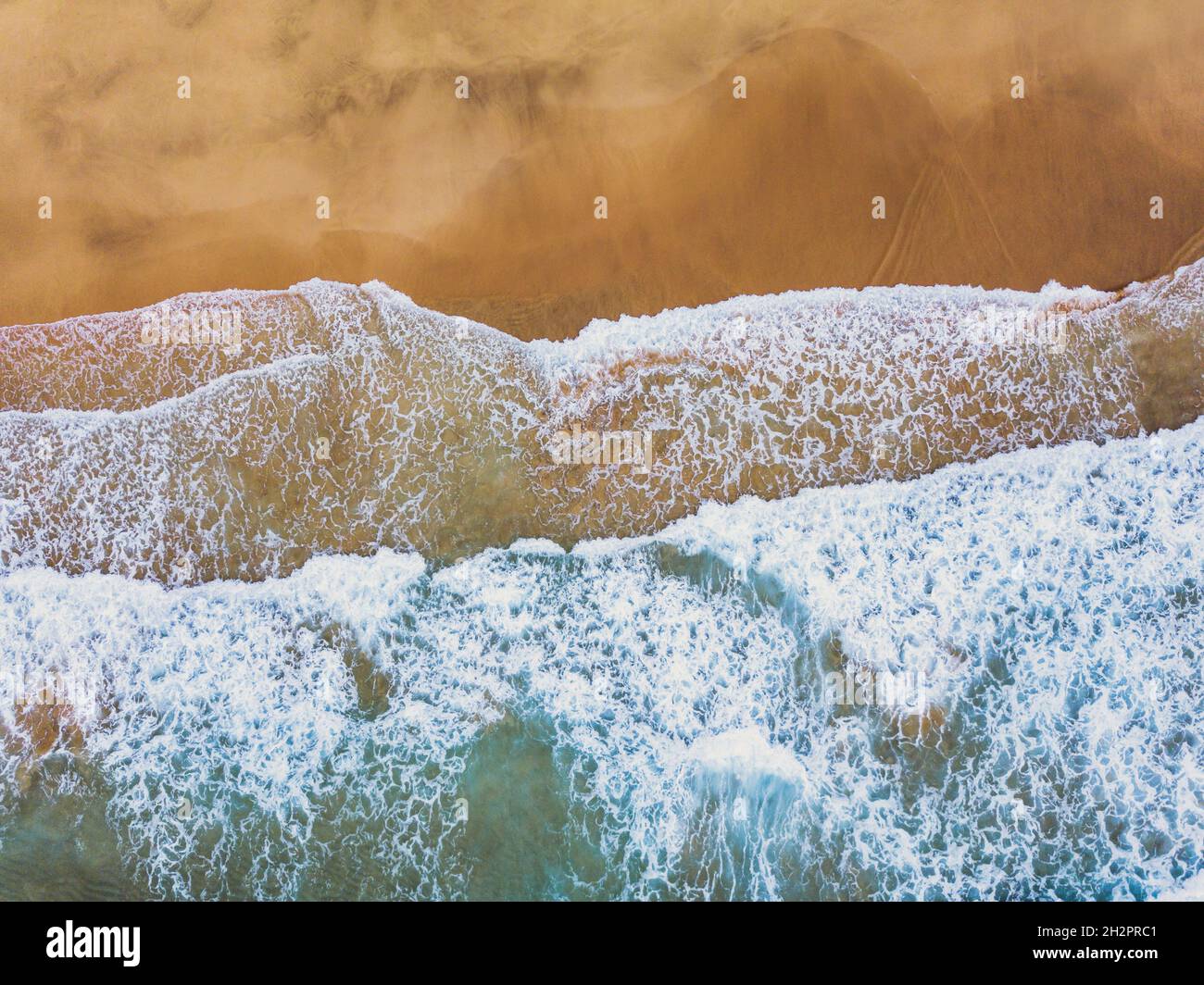 beautiful ocean wave on sand beach, aerial landscape, top down view ...