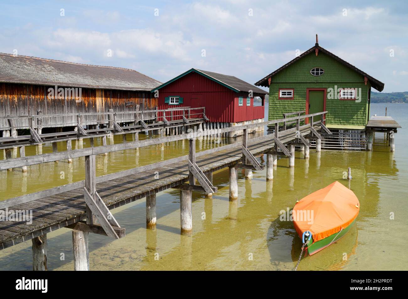 colorful boat houses on lake Ammersee in the German fishing village ...