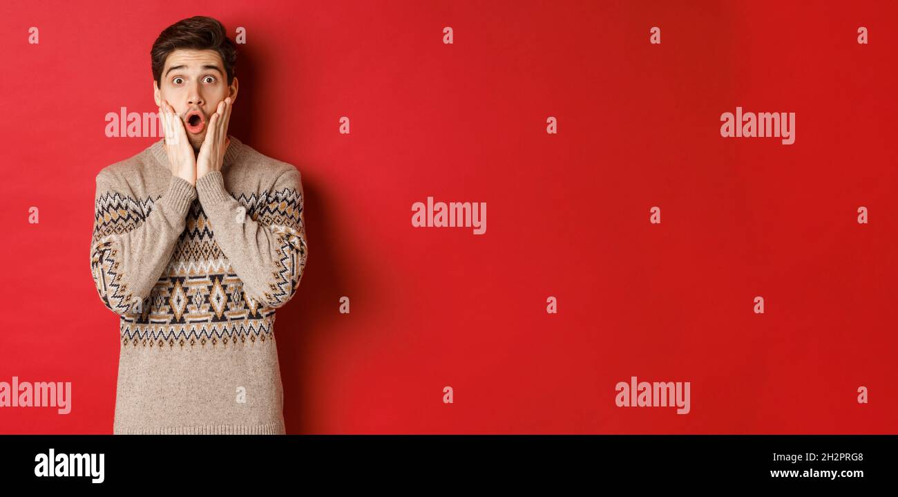 Image of surprised handsome guy reacting to cool new year promo offer ...