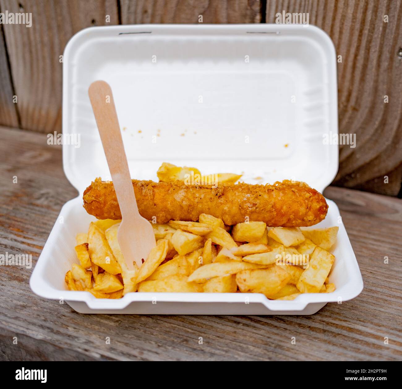 Close and selective focus on a polystyrene carton comprising a battered ...