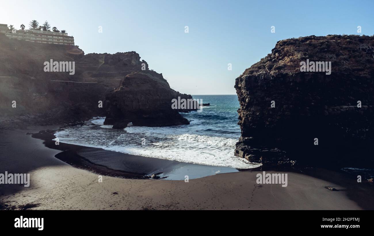 Aerial view of the wavy North Atlantic ocean hitting the rocky cliffs ...