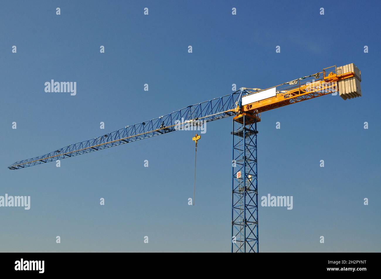 Steel hoisting construction mechanics crane background blue sky Stock ...