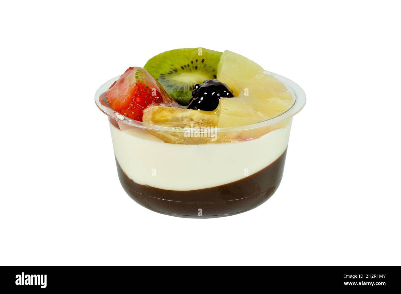 Chocolate milk and fruity pudding in a transparent cup, isolated on ...