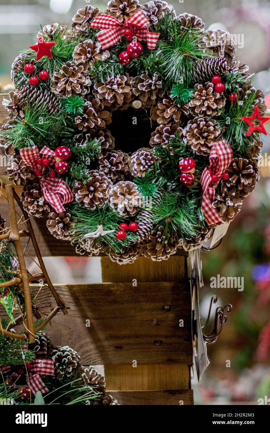 Beautiful Christmas wreath displayed on store front Stock Photo - Alamy