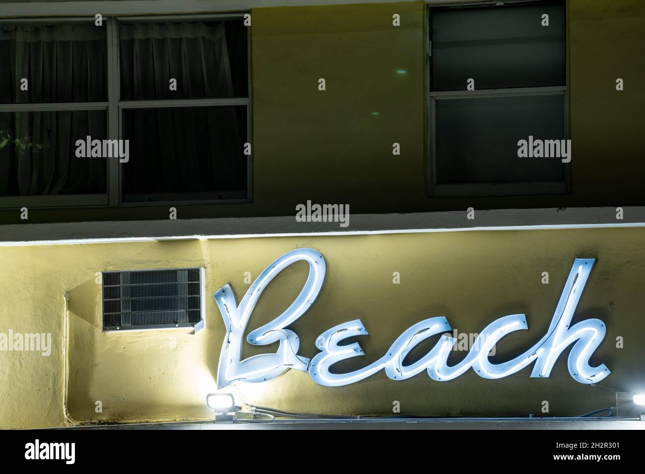 Beach neon sign at night Stock Photo - Alamy