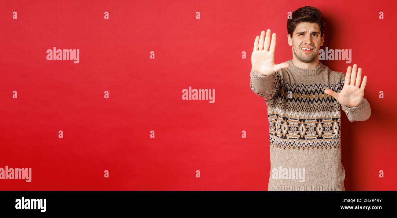 Image of disappointed handsome man, asking to stop, rejecting something ...