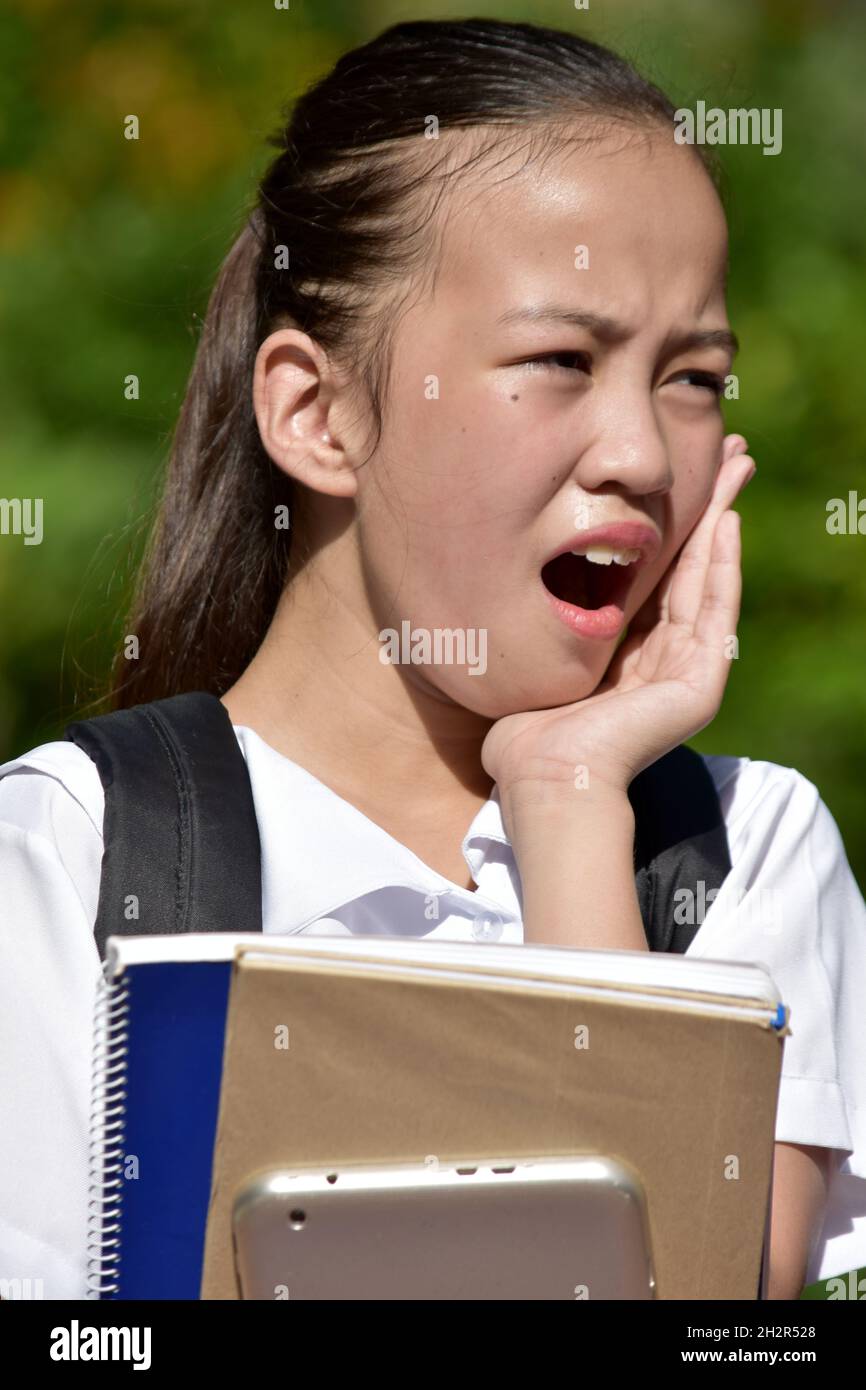 A Young Girl Student With Toothache Stock Photo - Alamy