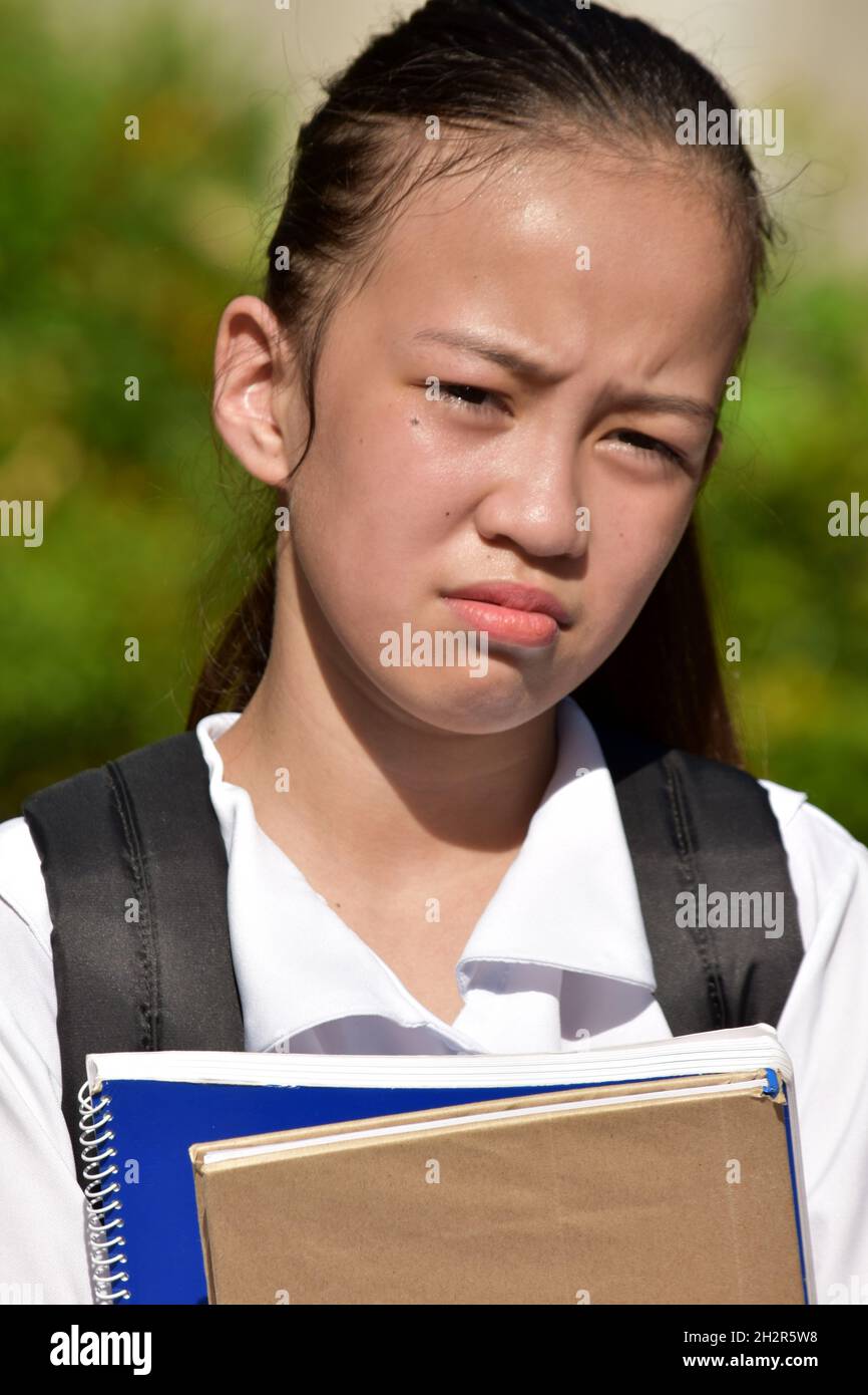 An Unhappy Cute Female Student Stock Photo - Alamy