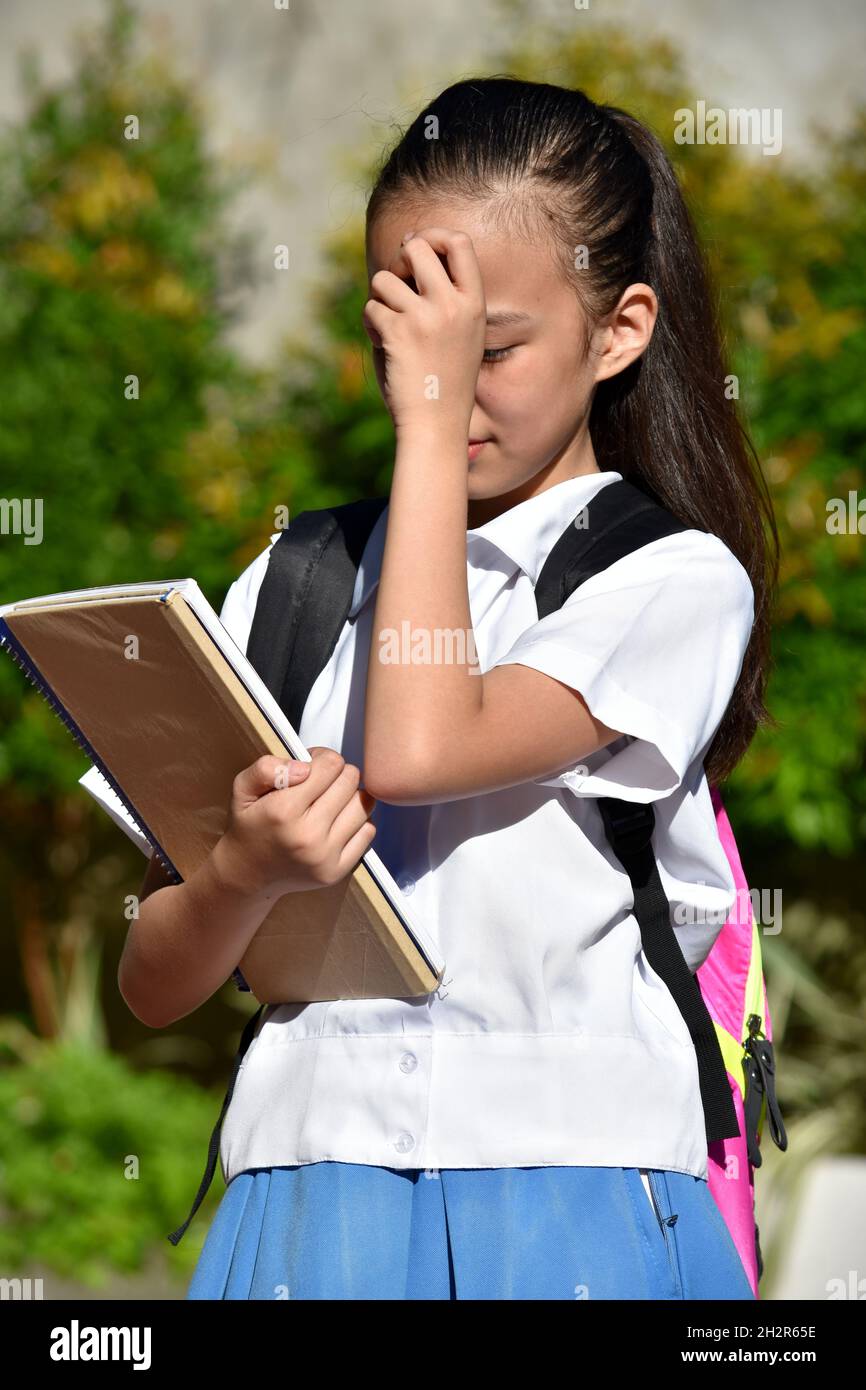 Beautiful Female Student And Shyness Wearing Uniform Stock Photo - Alamy