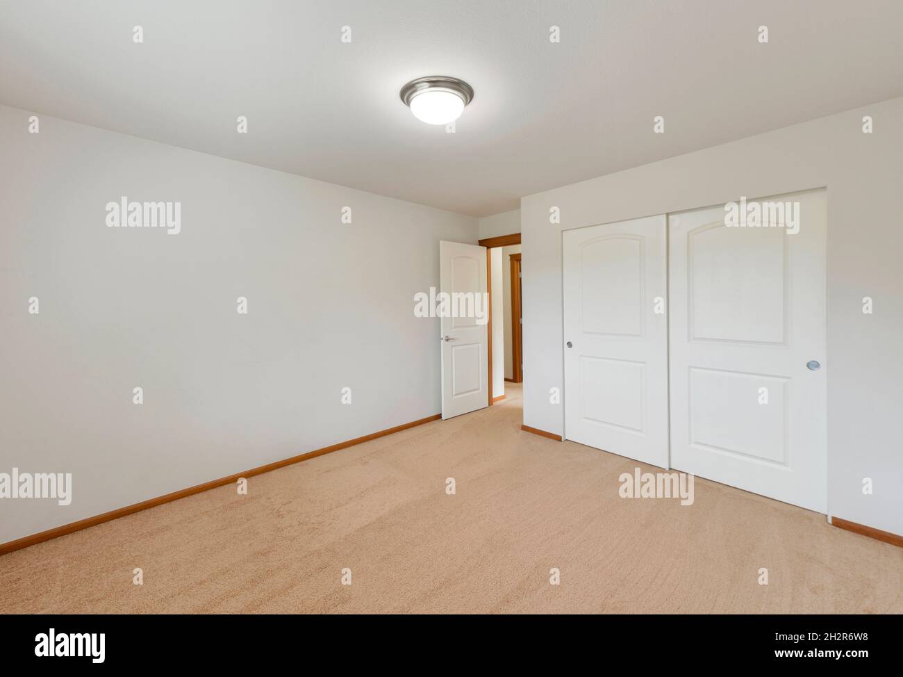 Modern residential empty bedroom interior Stock Photo - Alamy