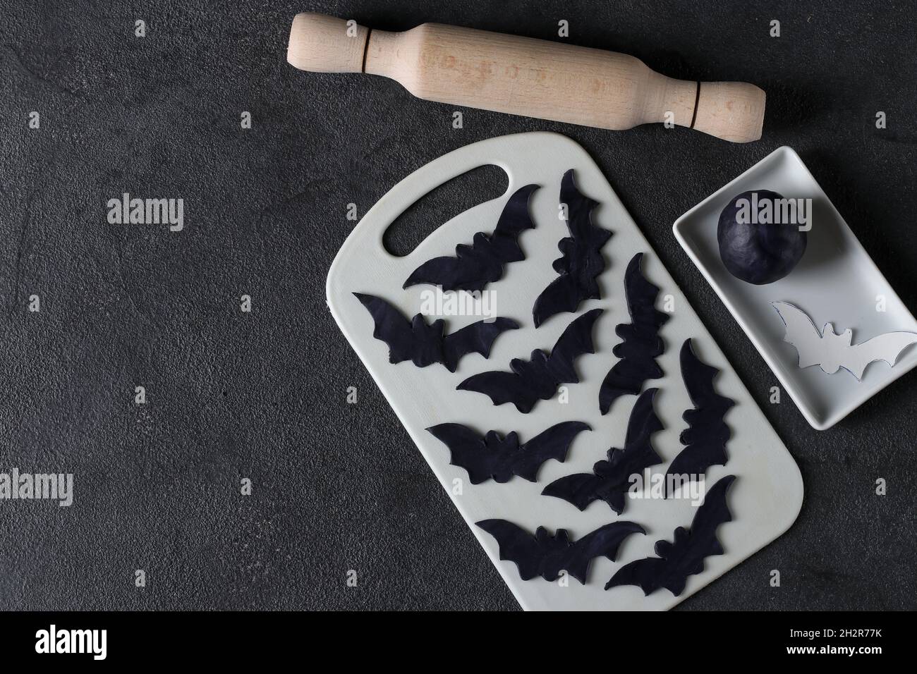 Cooking figures of bats from black mastic for Halloween party Stock ...