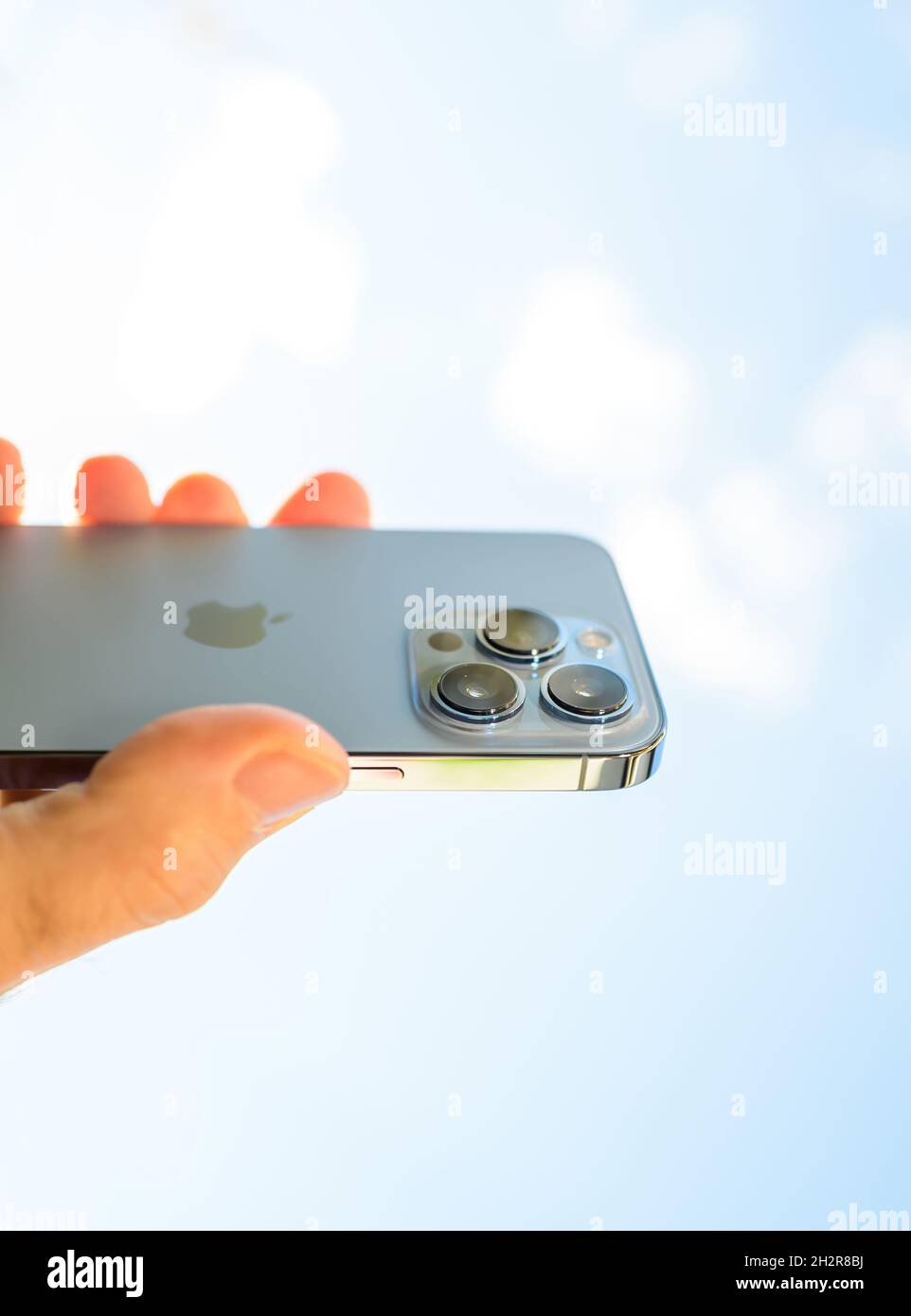 Male hand offering latest iPhone 13 Pro smartphone Stock Photo - Alamy