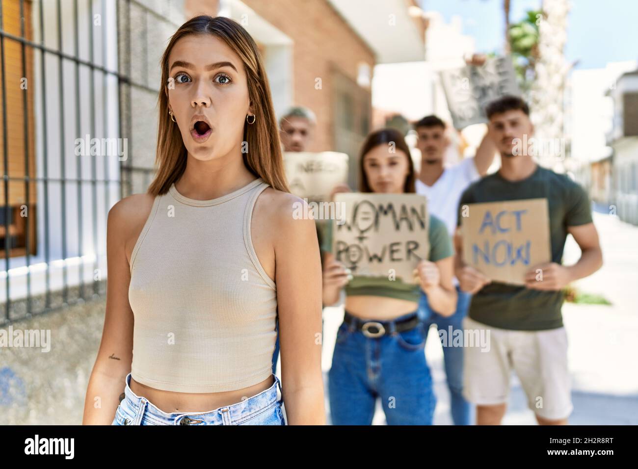 Group of people protesting and giving slogans at the street scared and ...