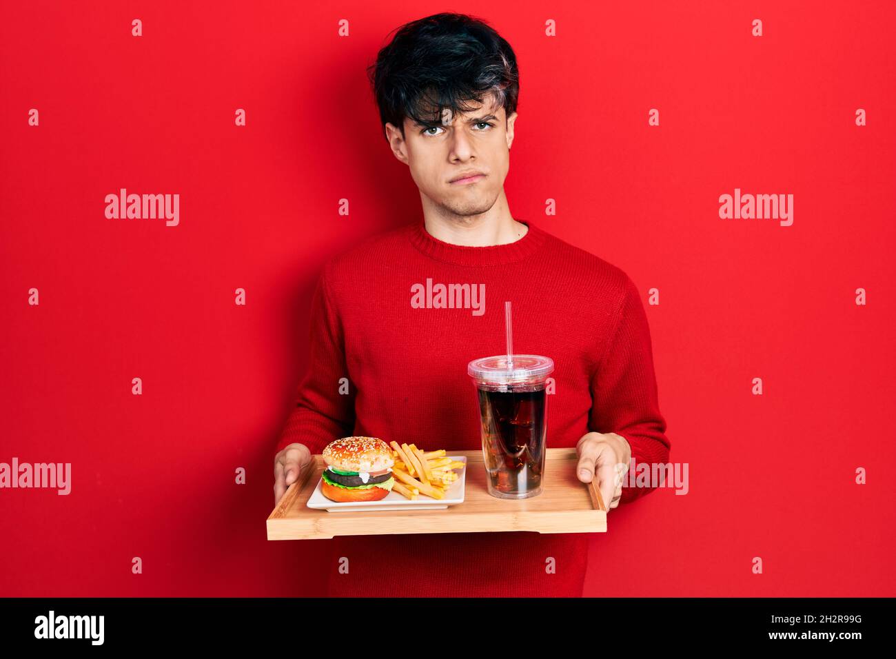 Nervous person eating hamburger hi-res stock photography and images - Alamy