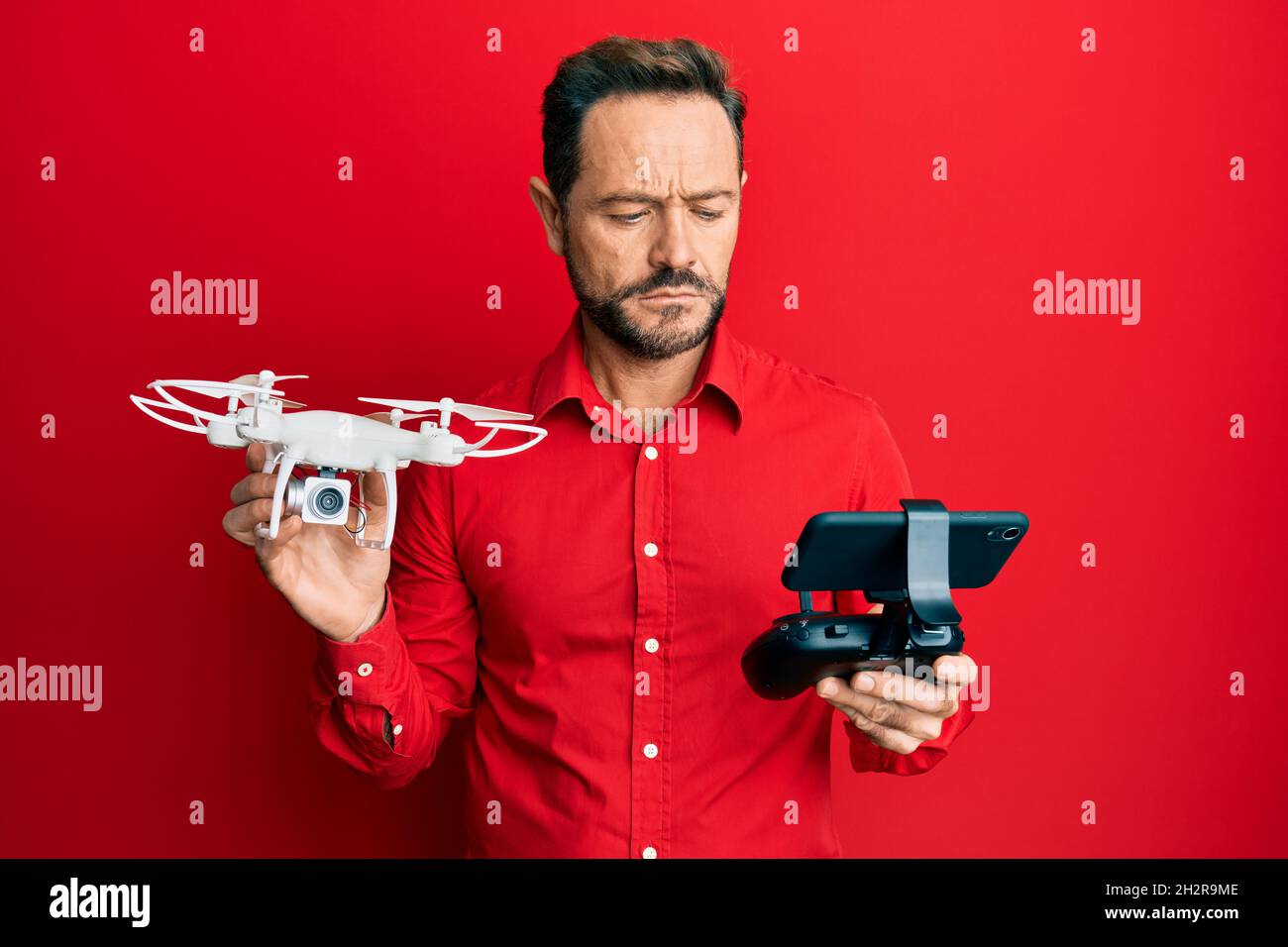 Middle age man using drone depressed and worry for distress, crying ...
