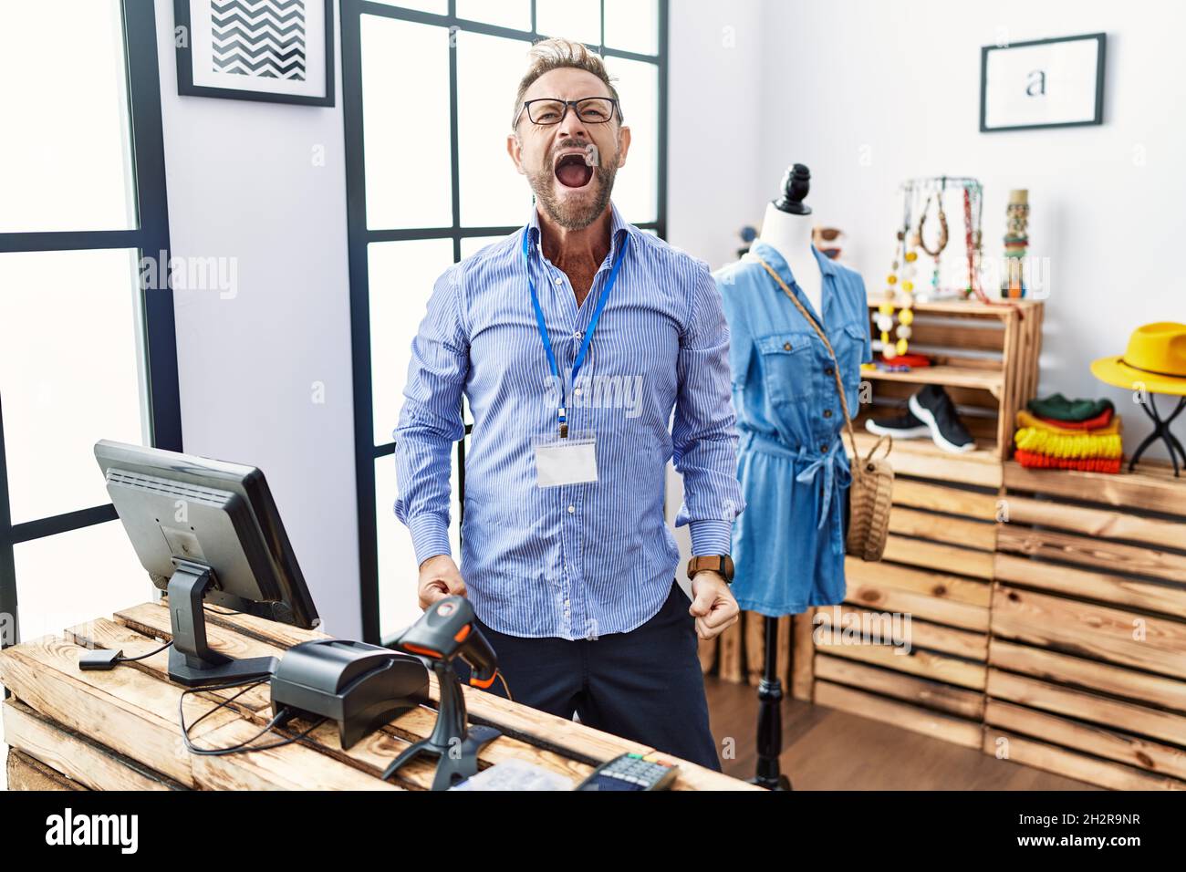 Male shop assistant unhappy hi-res stock photography and images - Alamy