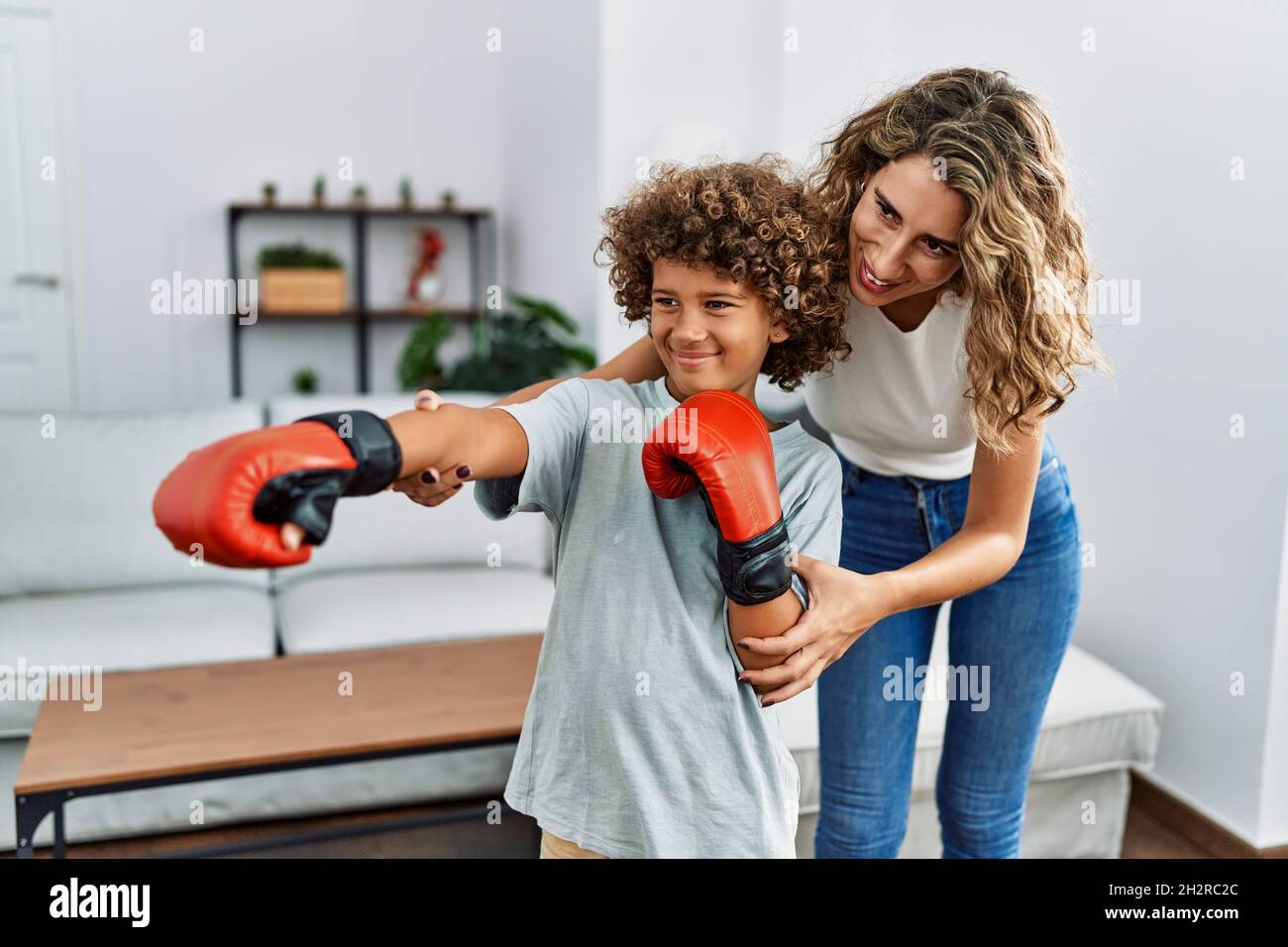 Mother and son smiling confident boxing at home Stock Photo - Alamy