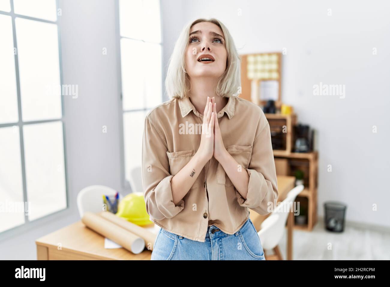 Woman pleading with builder hi-res stock photography and images - Alamy