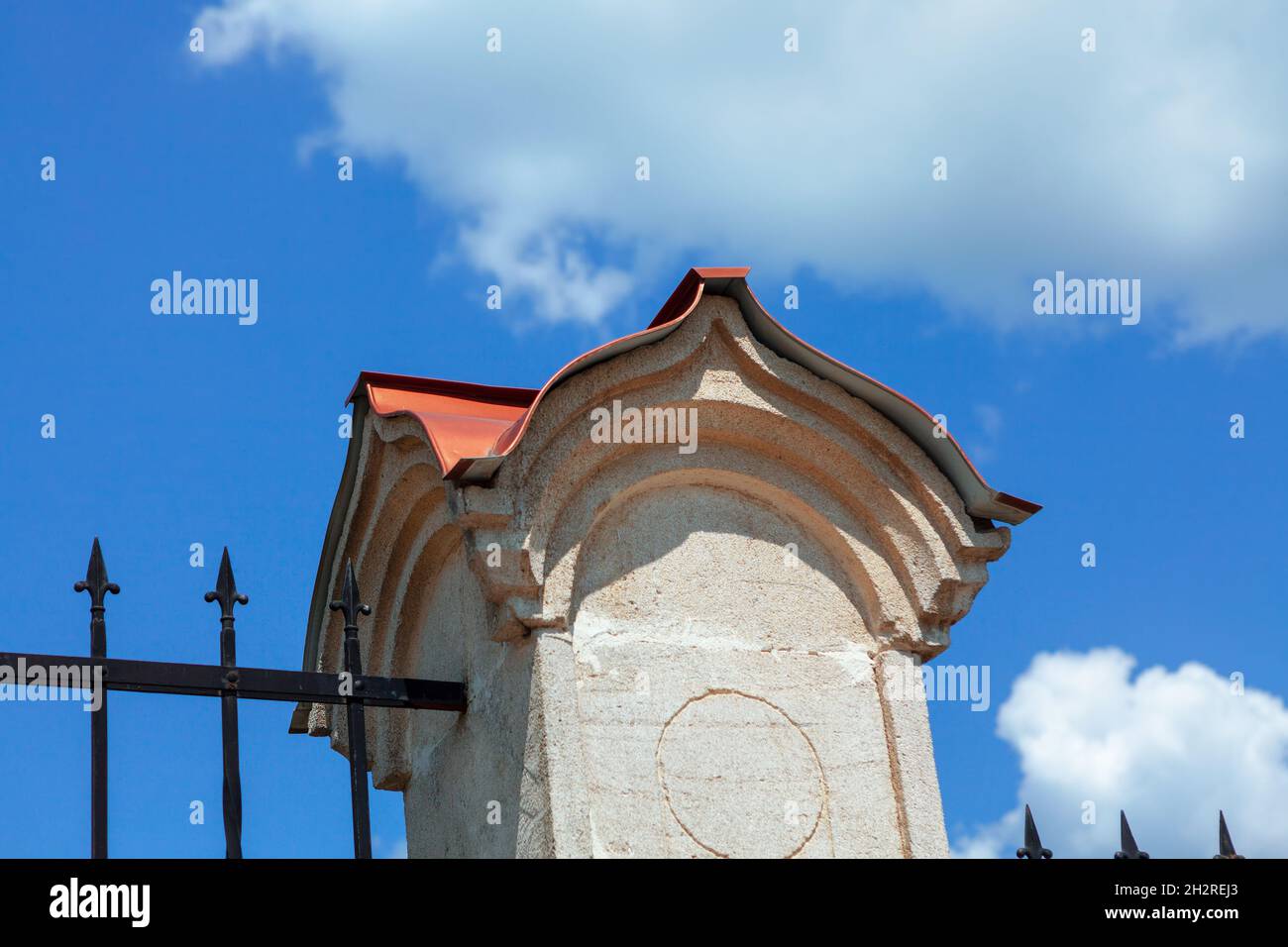 Fencing connected to stone column . Tile fence post Stock Photo - Alamy