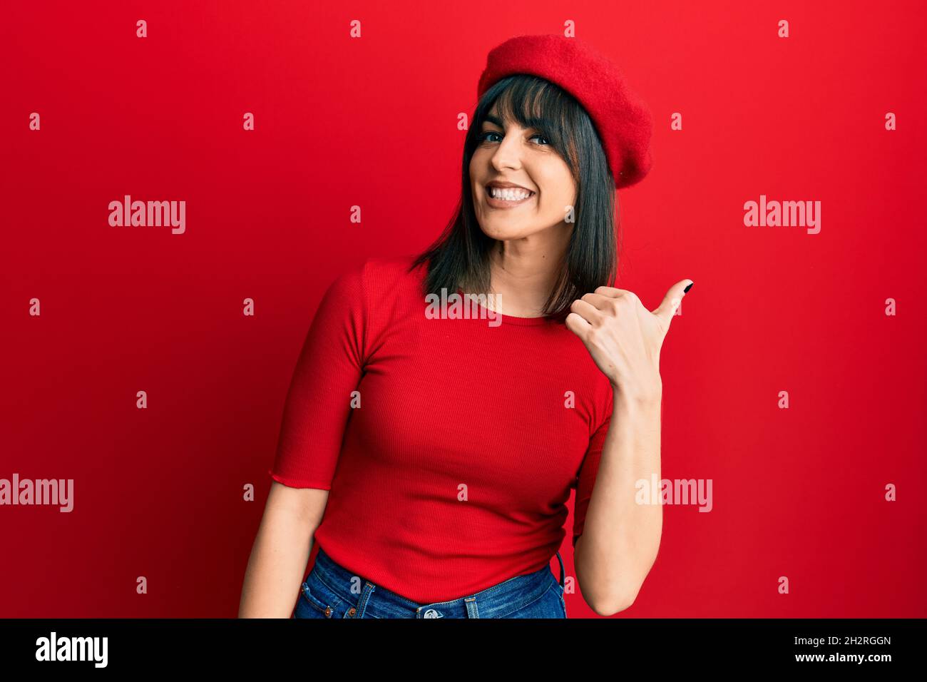 Young hispanic woman wearing french look with beret smiling with happy ...