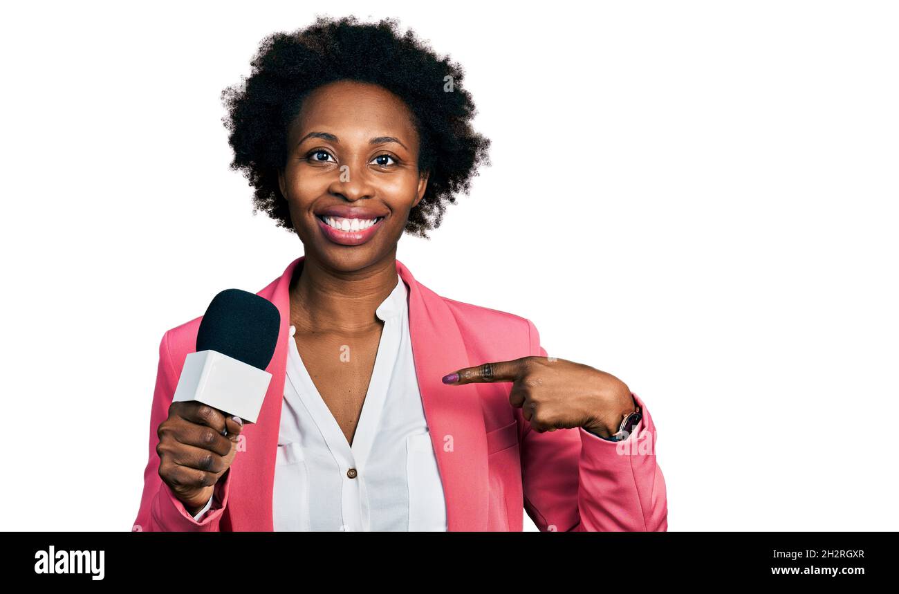 African american woman with afro hair holding reporter microphone ...