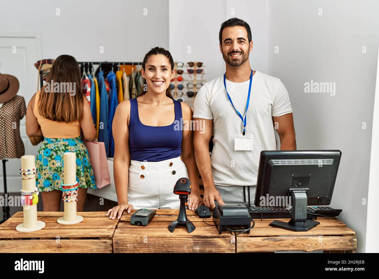 Group of young hispanic people working as manager at retail boutique ...
