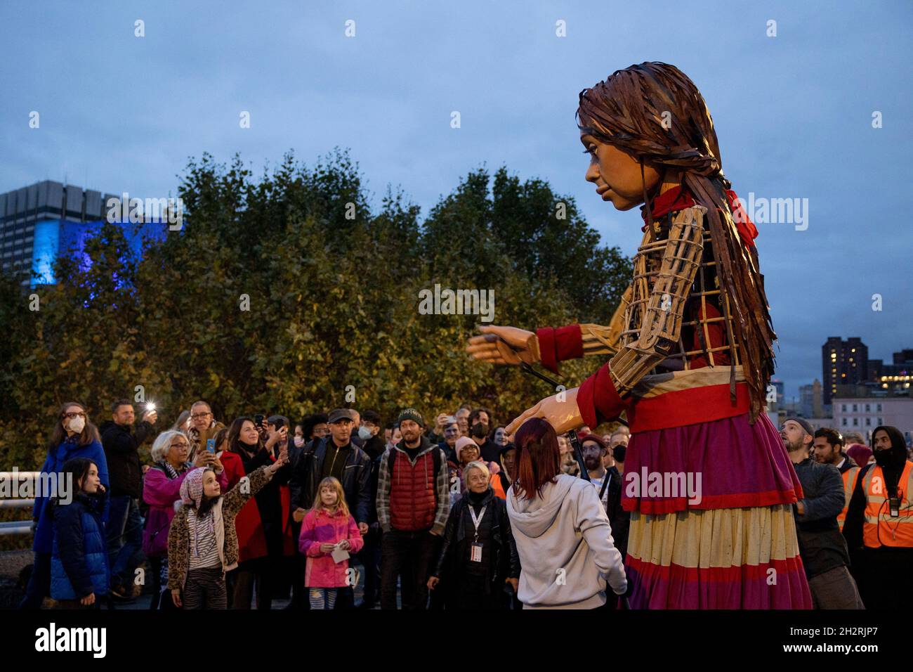 London, UK. 23rd Oct, 2021. A child seen reaching out to the little ...