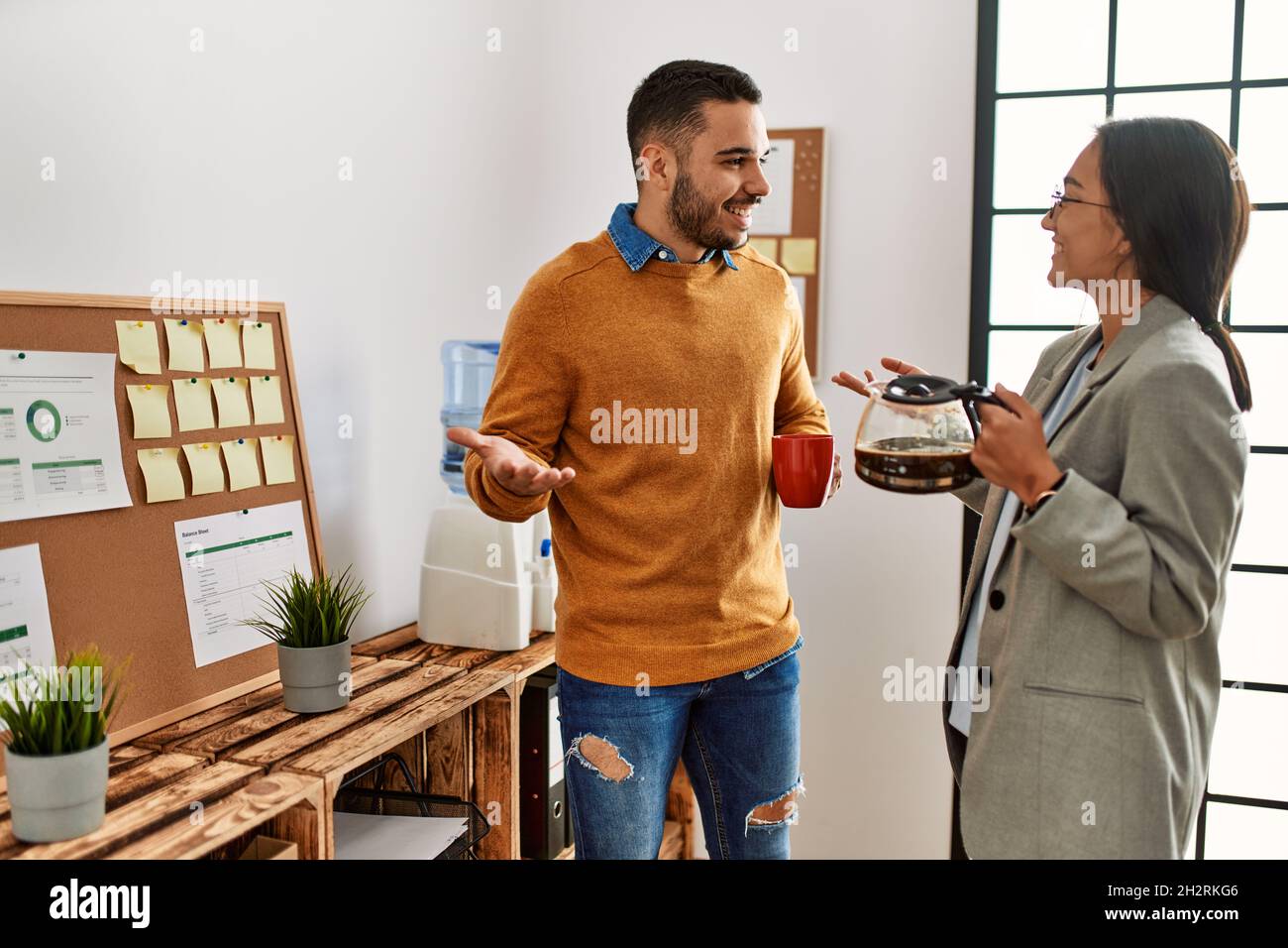 Two business workers relaxed drinking coffee at the office Stock Photo ...