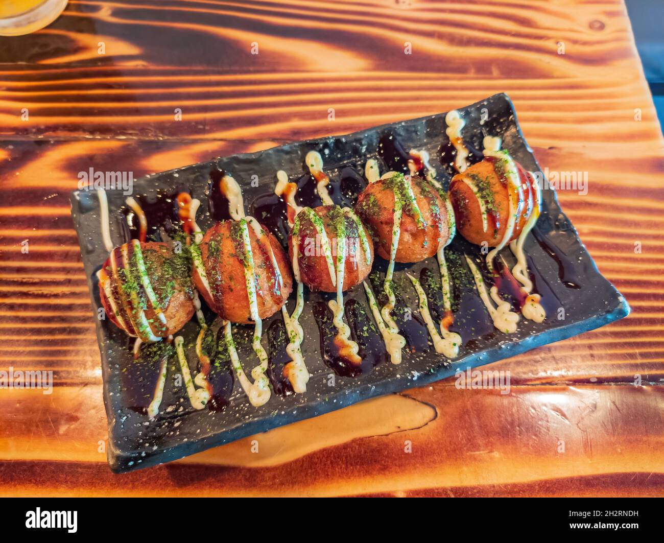 Close up shot of deep fried octopus ball at Oklahoma Stock Photo - Alamy