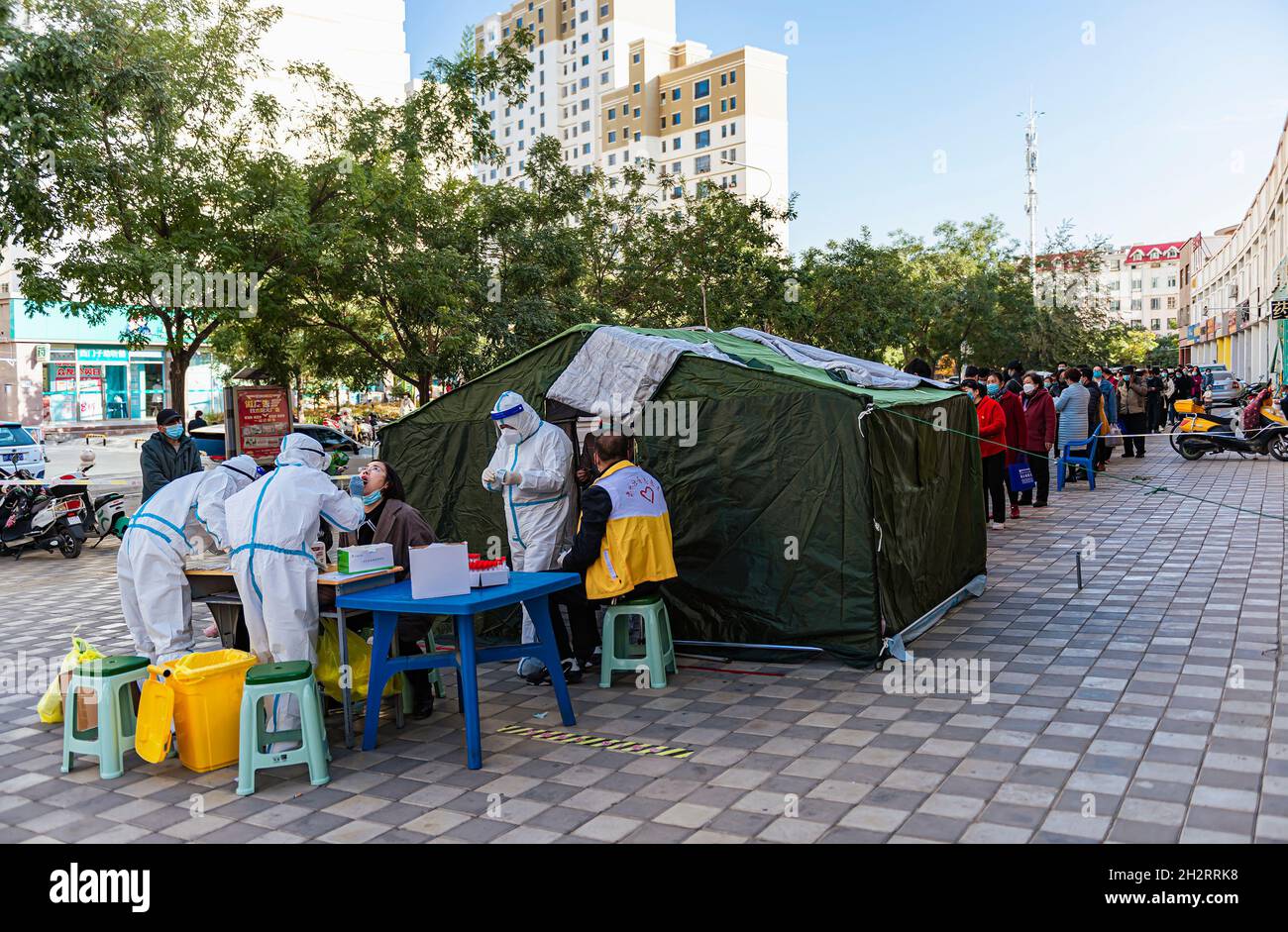 JIUQUAN, CHINA - OCTOBER 22, 2021 - A medical worker takes nucleic acid ...