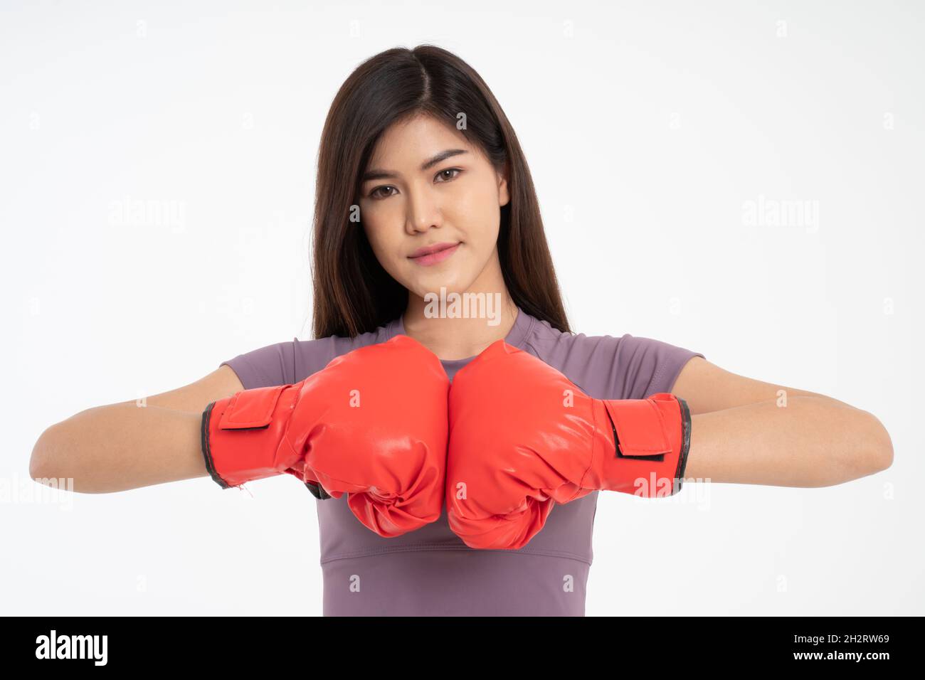 Portrait of beautiful Asian woman standing smile wearing the red boxing ...