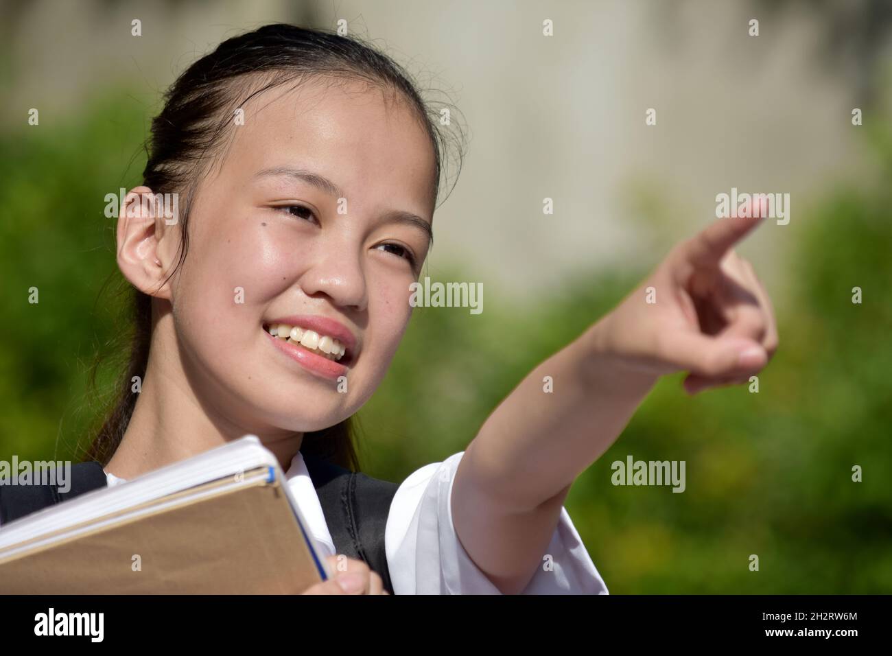A Beautiful Filipina Female Student Pointing Stock Photo - Alamy