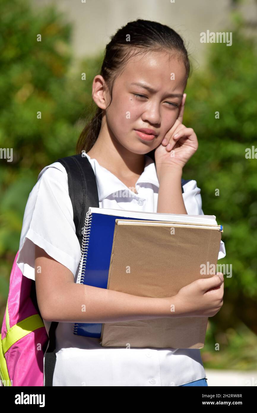 Filipina Girl Student Thinking With Books Stock Photo - Alamy