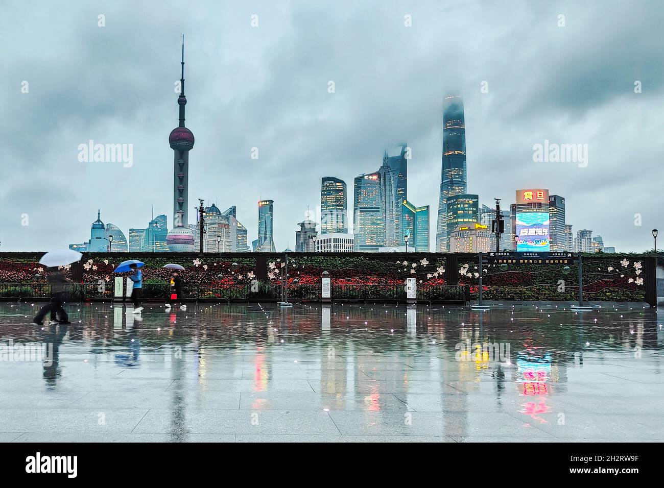 SHANGHAI, CHINA - OCTOBER 20, 2021 - Pedestrians walk in the rain on ...