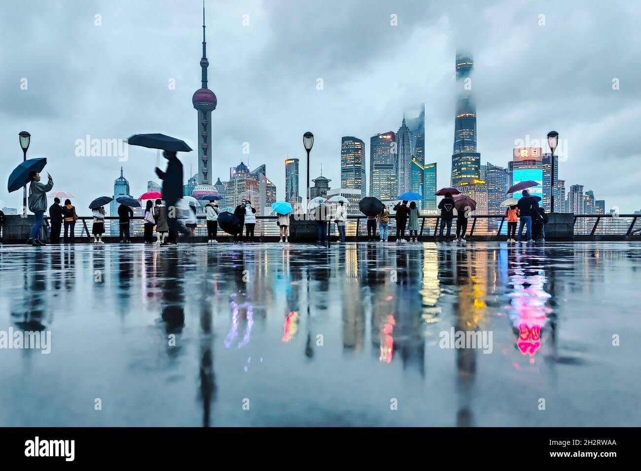 SHANGHAI, CHINA - OCTOBER 20, 2021 - Pedestrians walk in the rain on ...