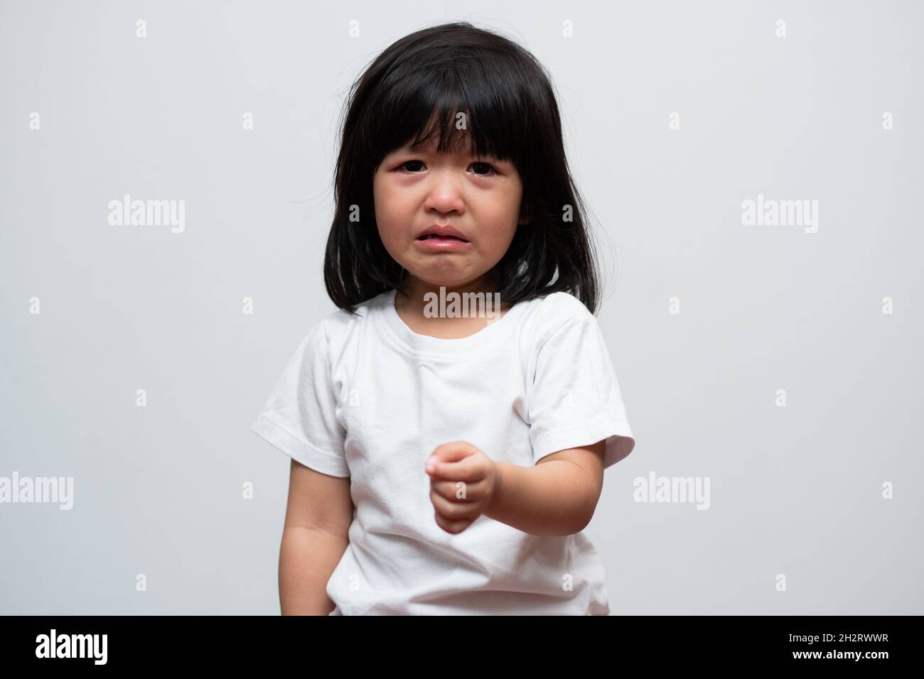 Portrait of Asian angry, sad and cry little girl on white isolated ...