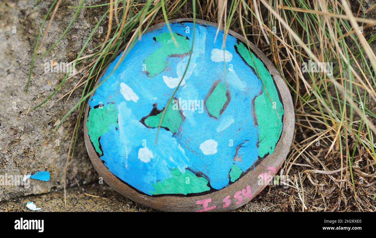 A closeup shot of rock with the earth pattern painted on the surface ...