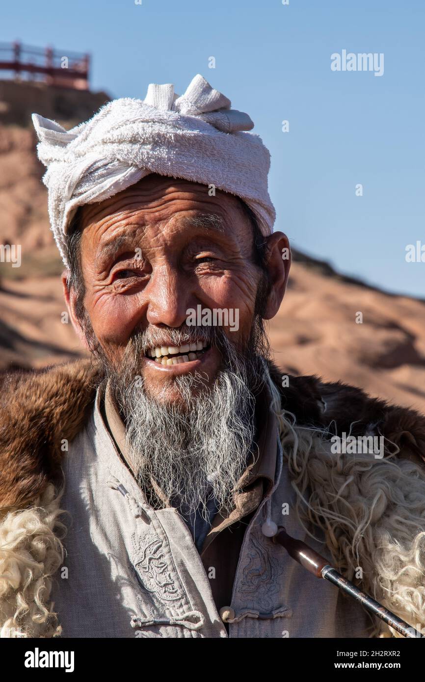 Elder Chinese man with turban at Jingbian, China Stock Photo - Alamy