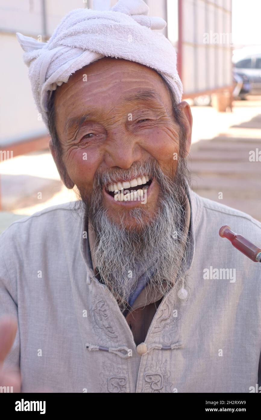 Elder Chinese man with turban at Jingbian, China Stock Photo - Alamy