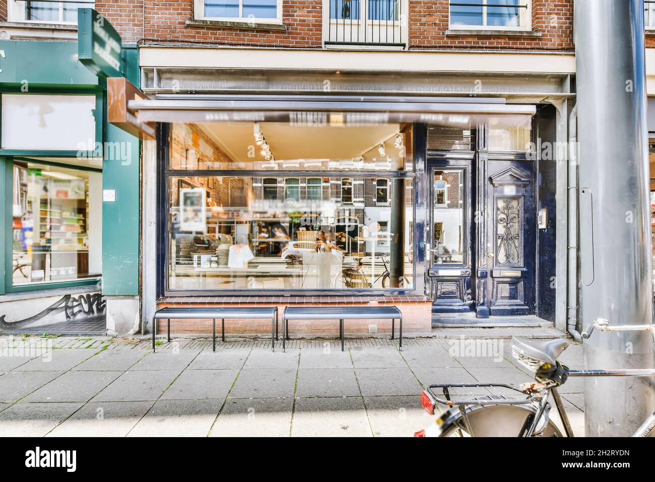 Stylish shop on the ground floor of the building Stock Photo - Alamy