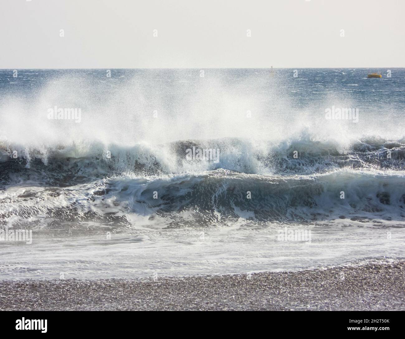 A natural view of strong waves hitting the shore at summertime Stock ...