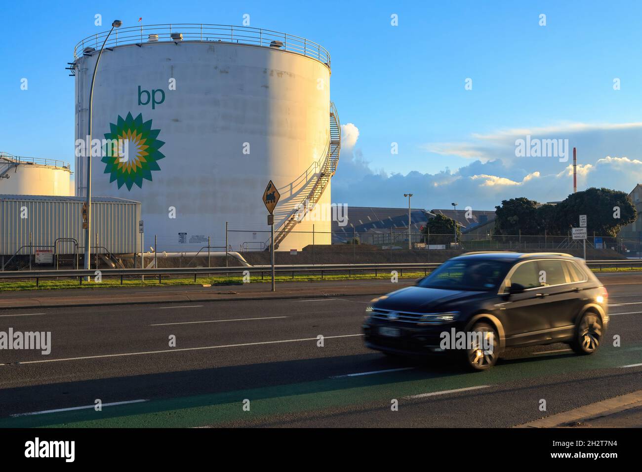 A giant BP fuel storage tank beside a motorway in Mount Maunganui, New ...