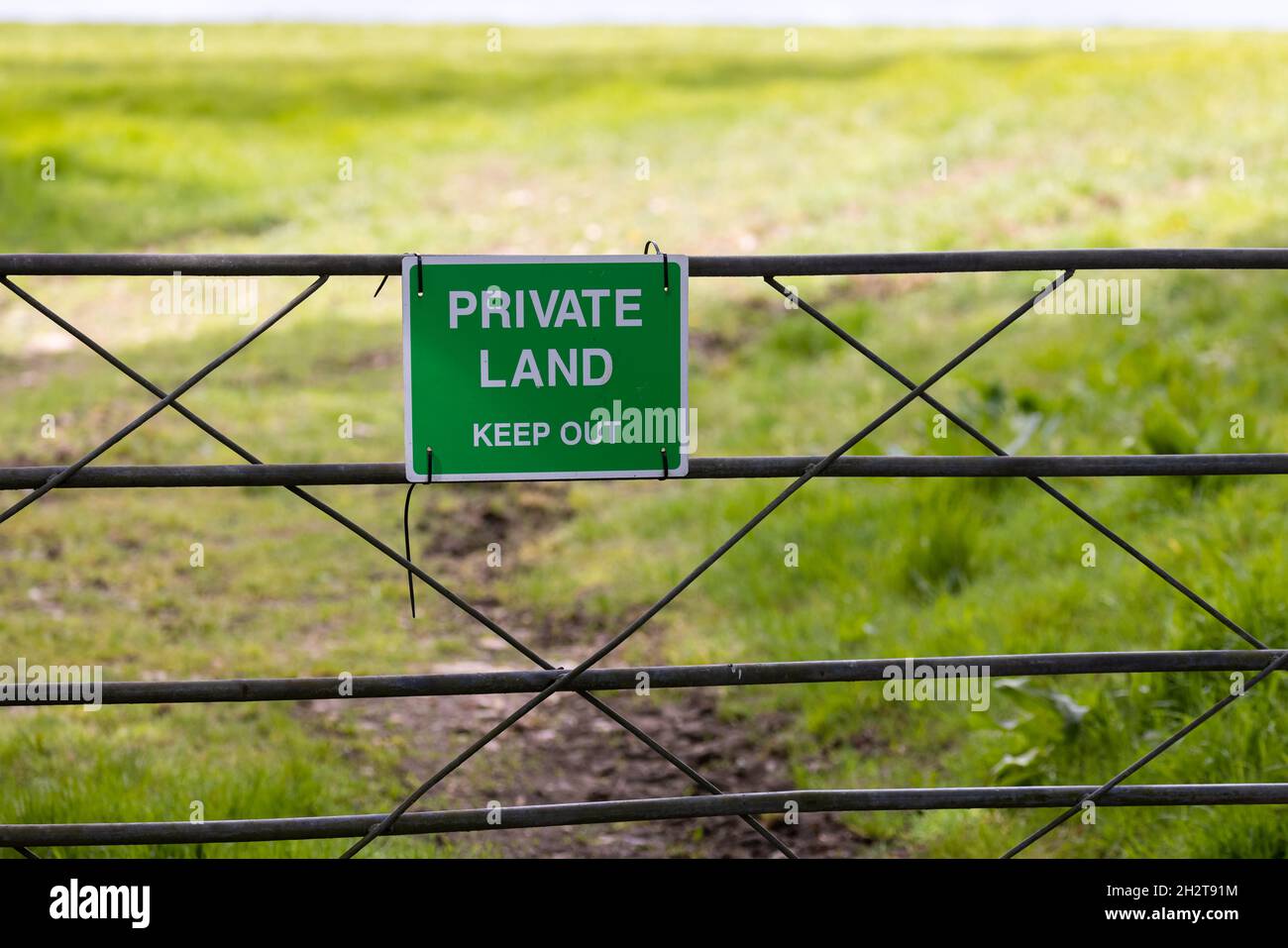 Private land sign on farm gate Stock Photo - Alamy