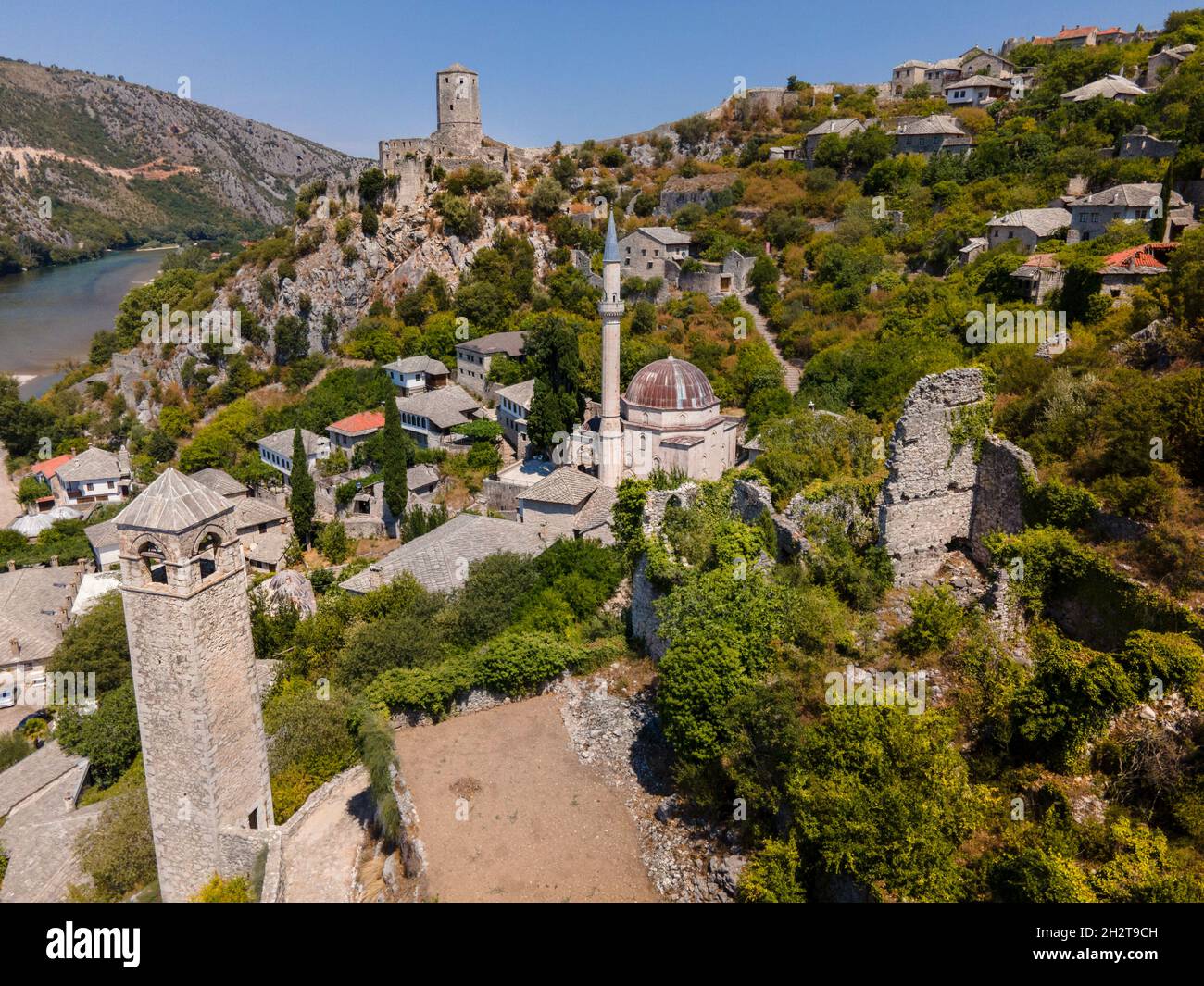 Aerial view of the urban buildings along the river in Pocitelj, Bosnia ...