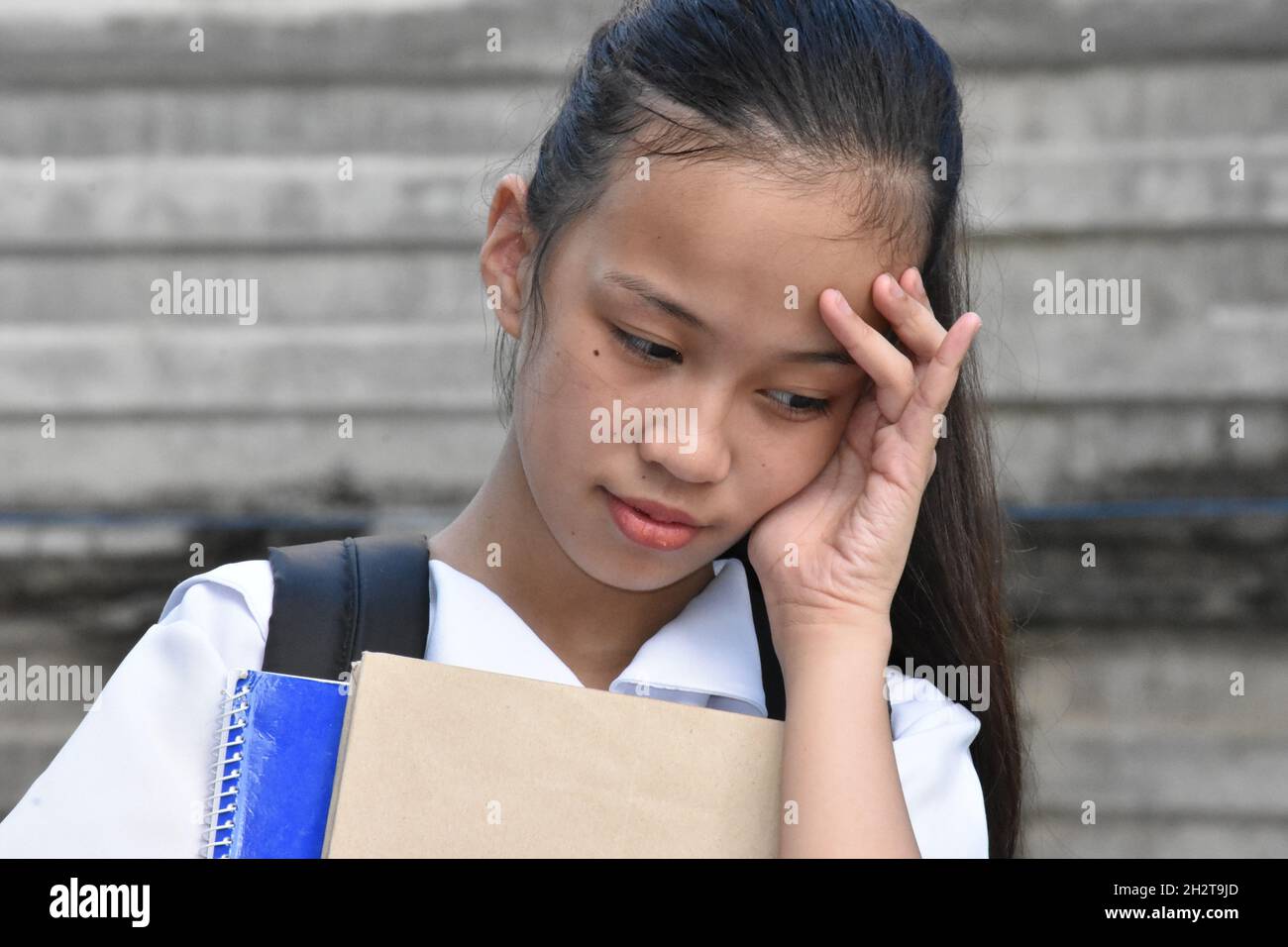 Diverse Female Student And Worry With Books Stock Photo - Alamy