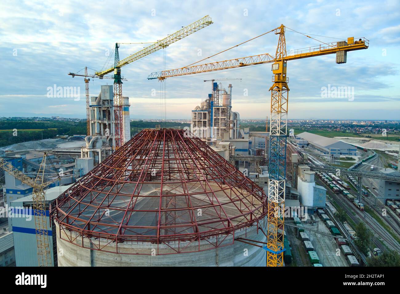 Aerial view of cement factory under construction with high concrete ...