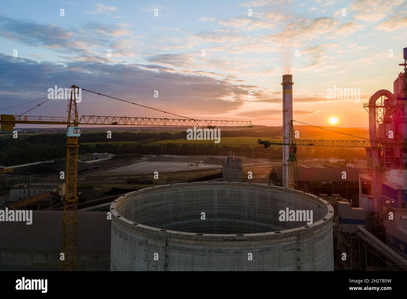 Aerial view of cement factory under construction with high concrete ...