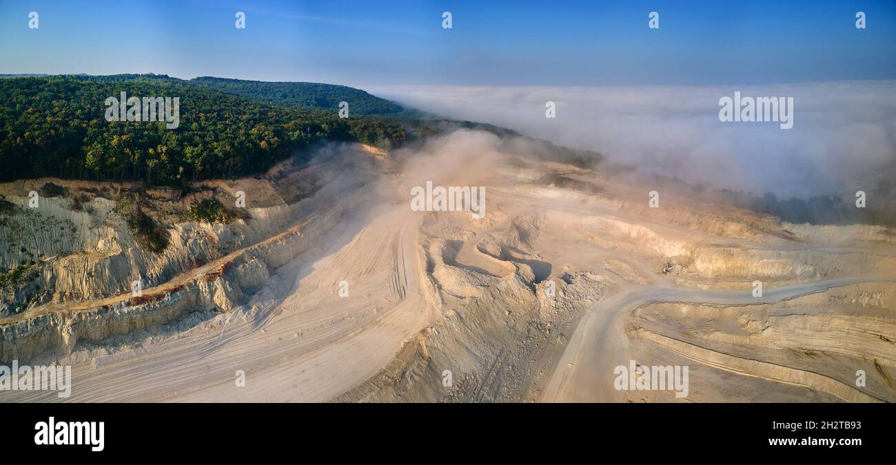Aerial view of open pit mining of limestone materials for construction ...
