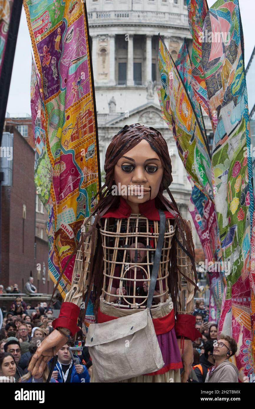 Little Amal crosses the Millennium Bridge.Little Amal is a giant puppet ...