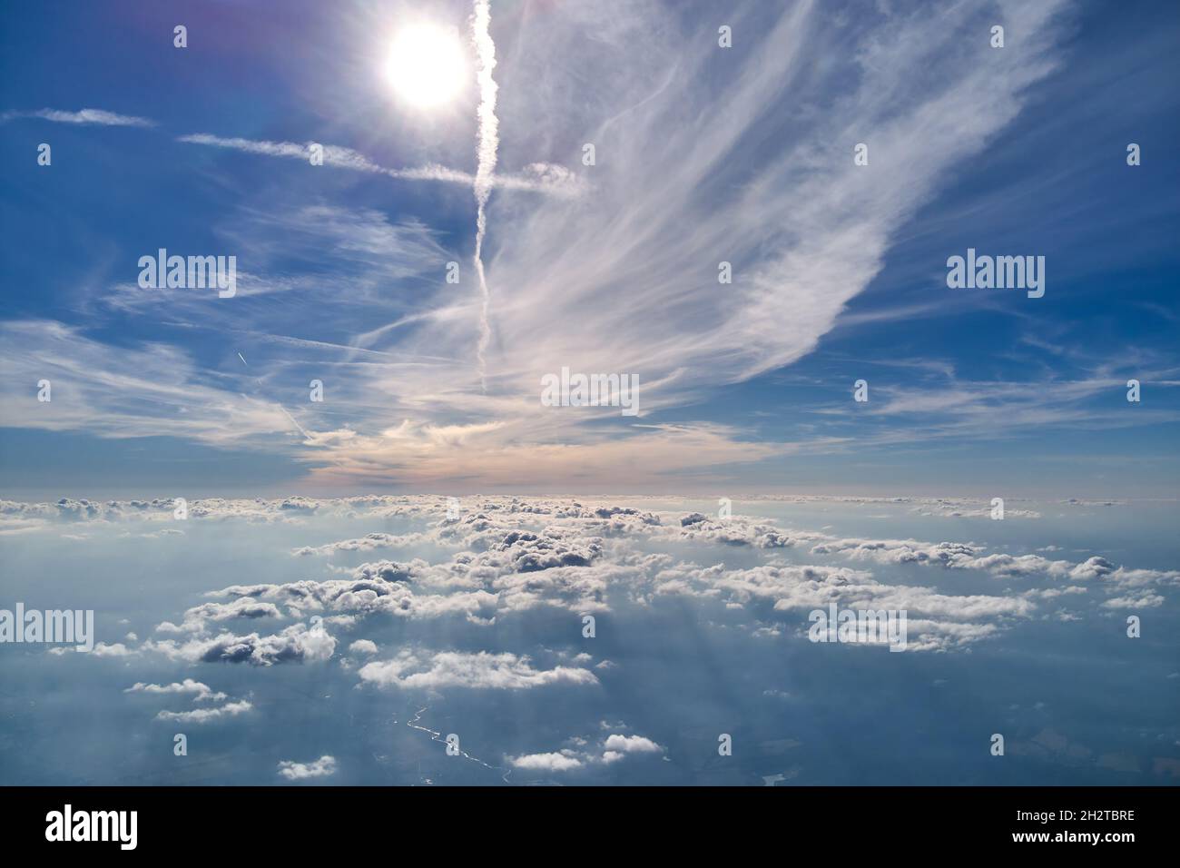 Aerial view from airplane window at high altitude of earth covered with ...